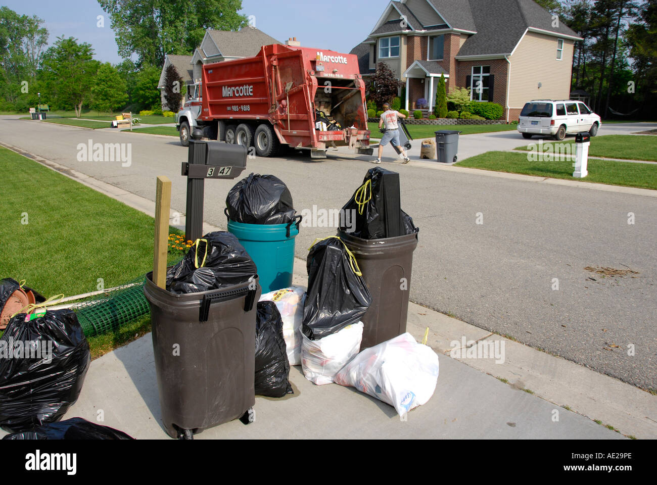 Residential trash collection crew pick up waste products Stock Photo ...