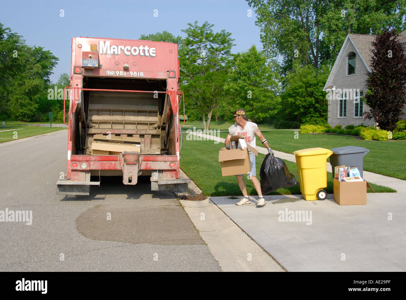 Residential trash collection crew pick up waste products Stock Photo ...