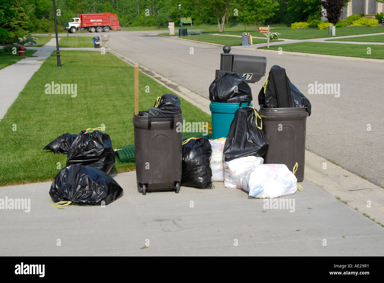 Residential trash collection crew pick up waste products Stock Photo ...