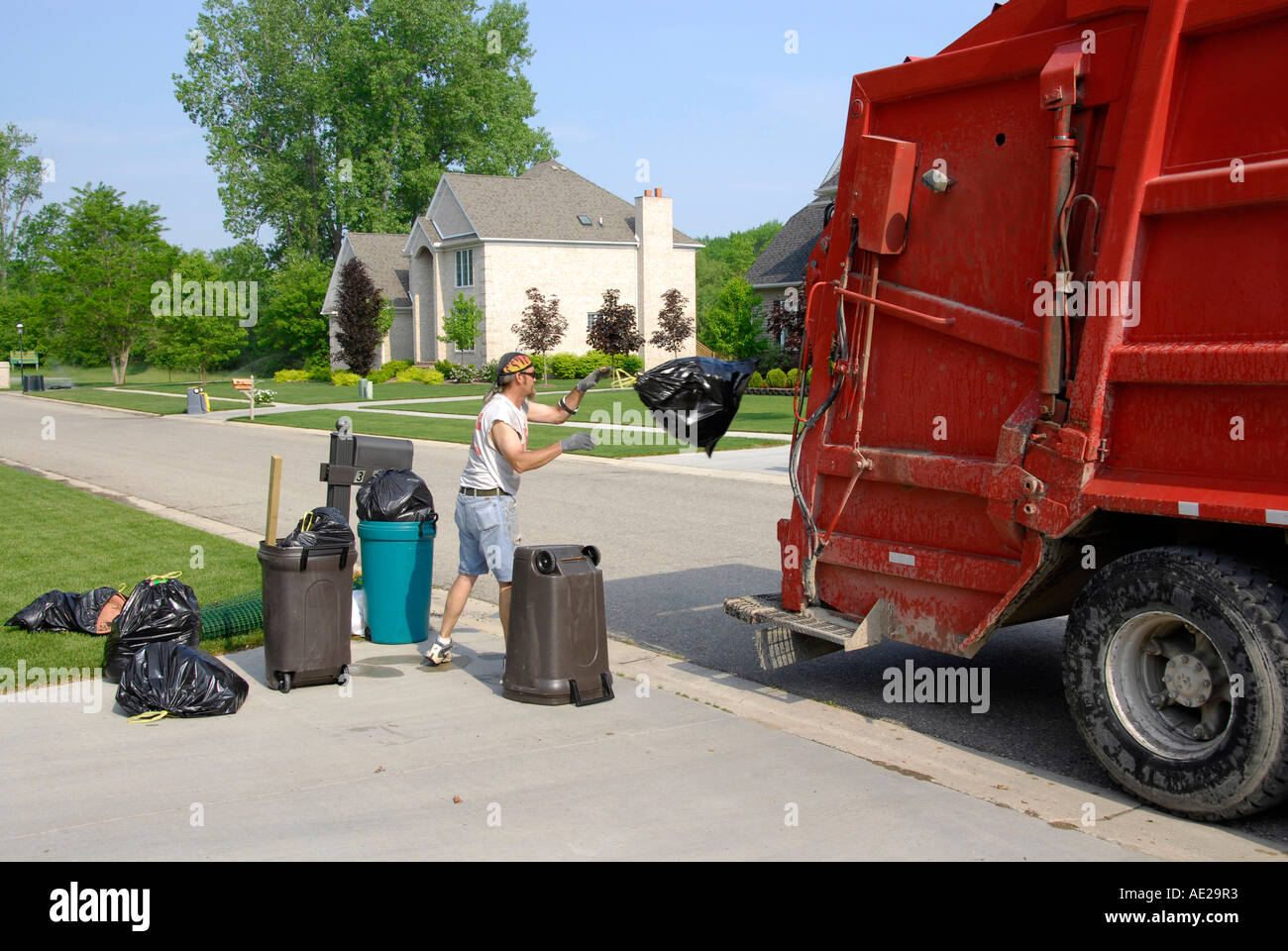 Residential trash collection crew pick up waste products Stock Photo ...