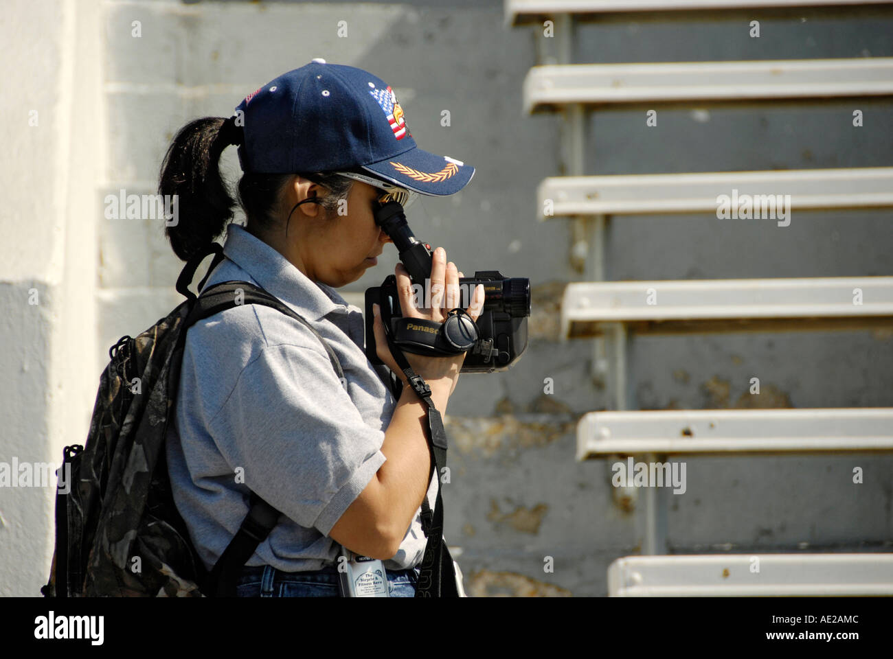 Female uses video camera to record and event Stock Photo - Alamy
