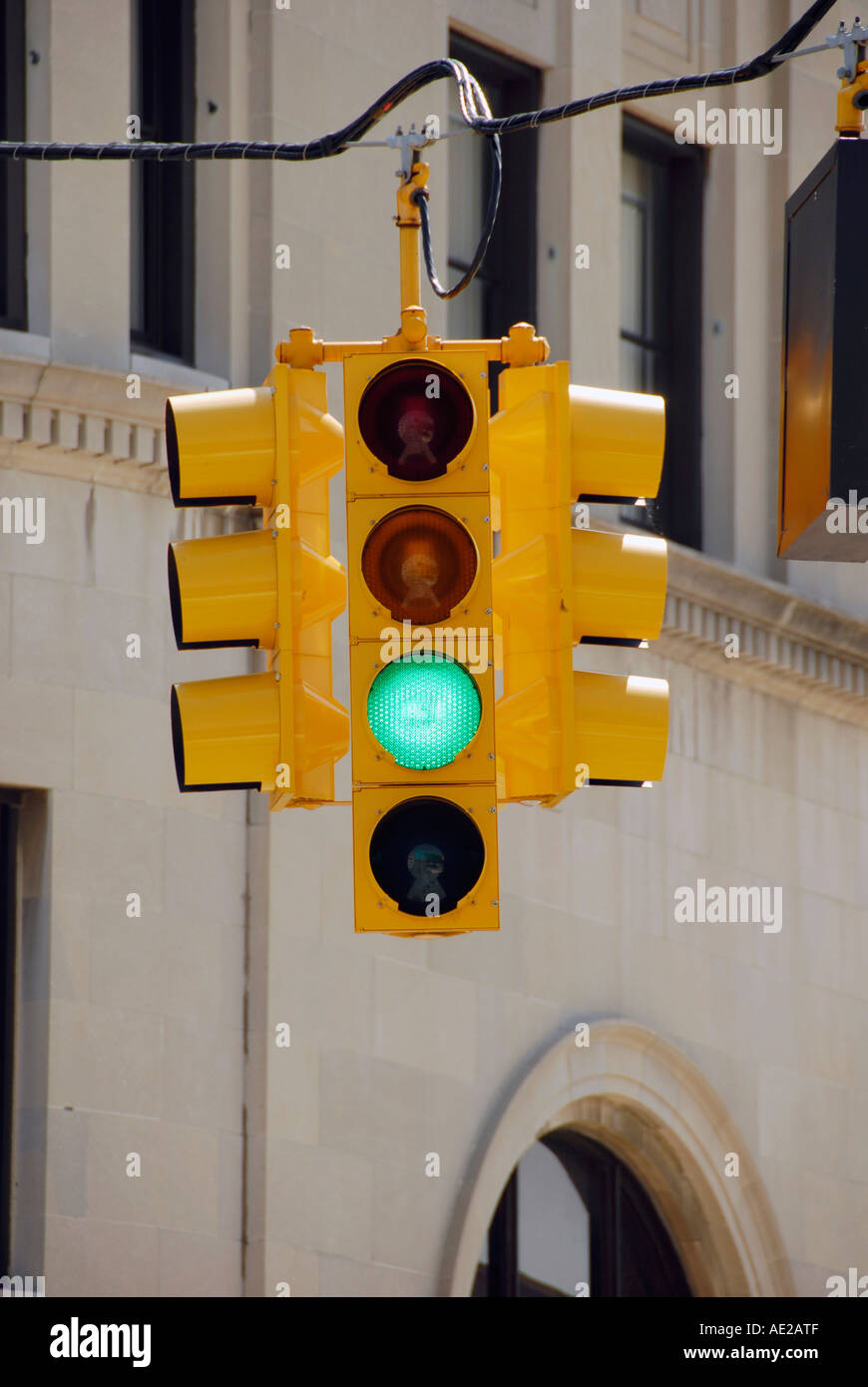 Traffic light regulates traffic flow through a street intersection ...