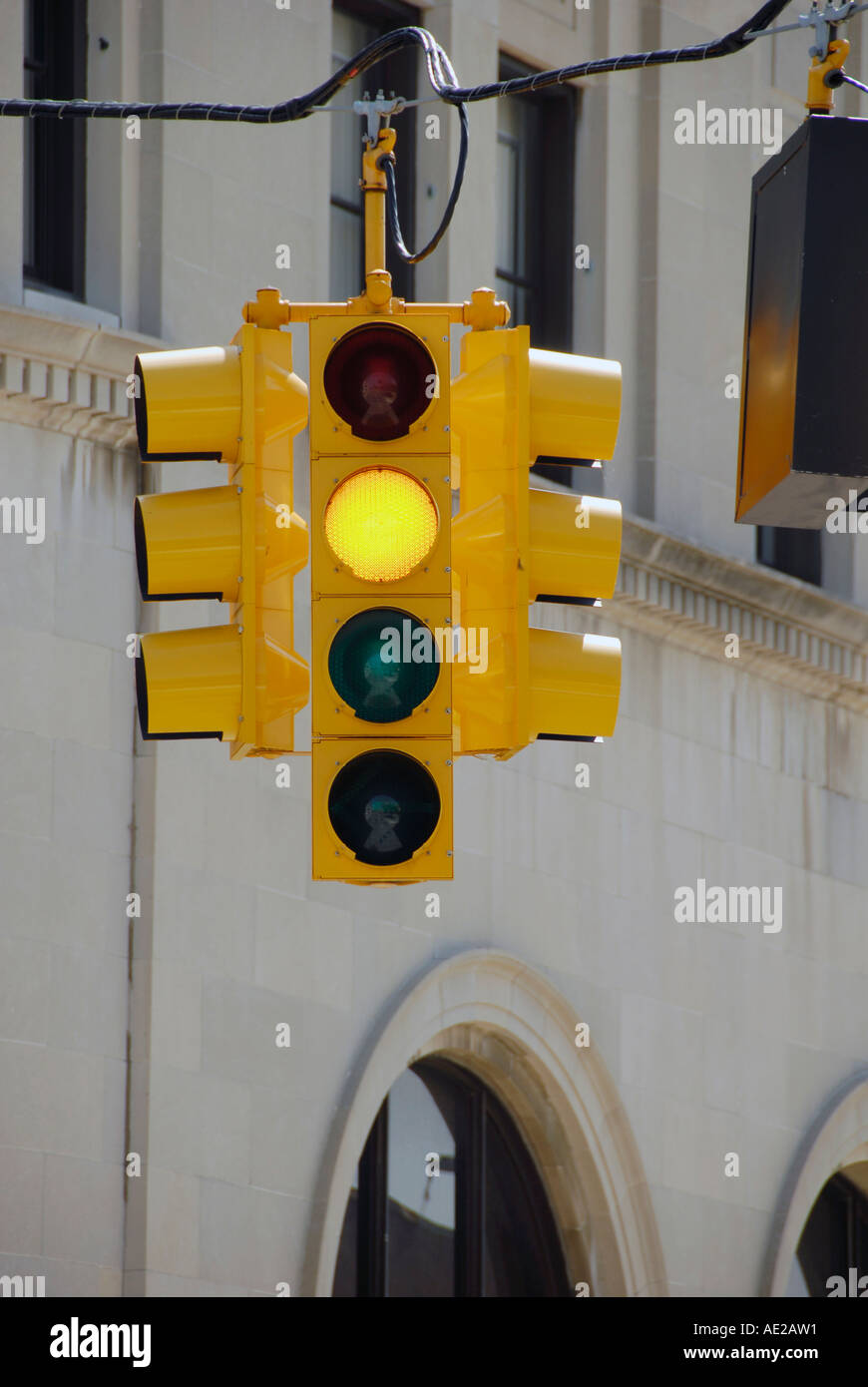 Traffic light regulates traffic flow through a street intersection ...