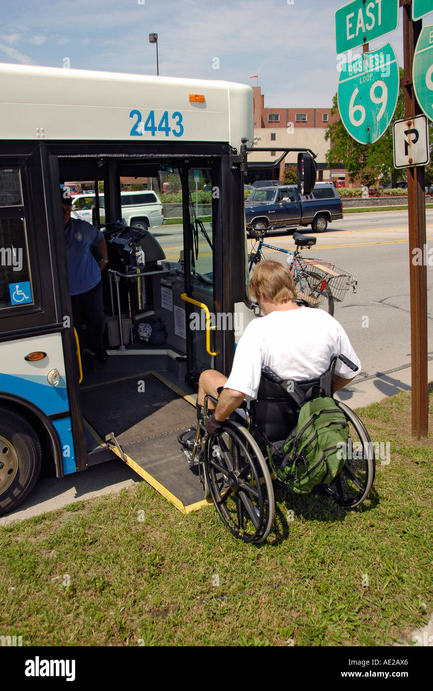 Handicapped male in a wheelchair board a public transportation bus ...