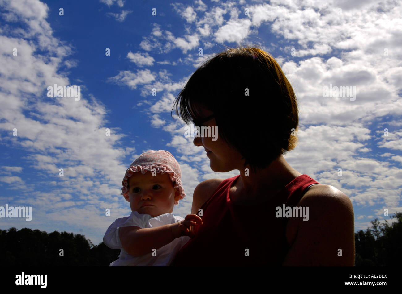 mother baby blue sky cirrus clouds summer colour color horizontal ...