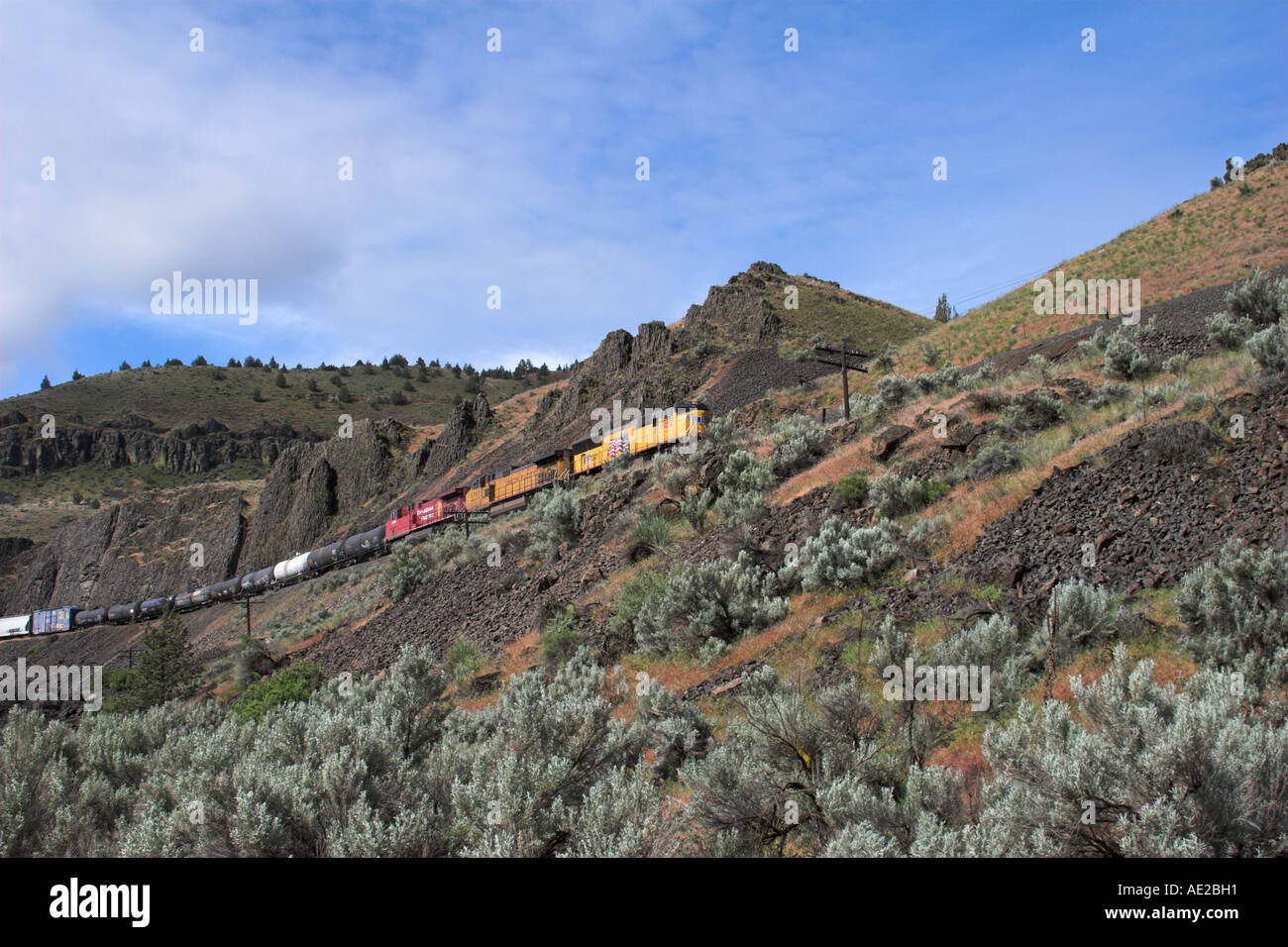 Train pulling grade in Central Oregon Stock Photo - Alamy