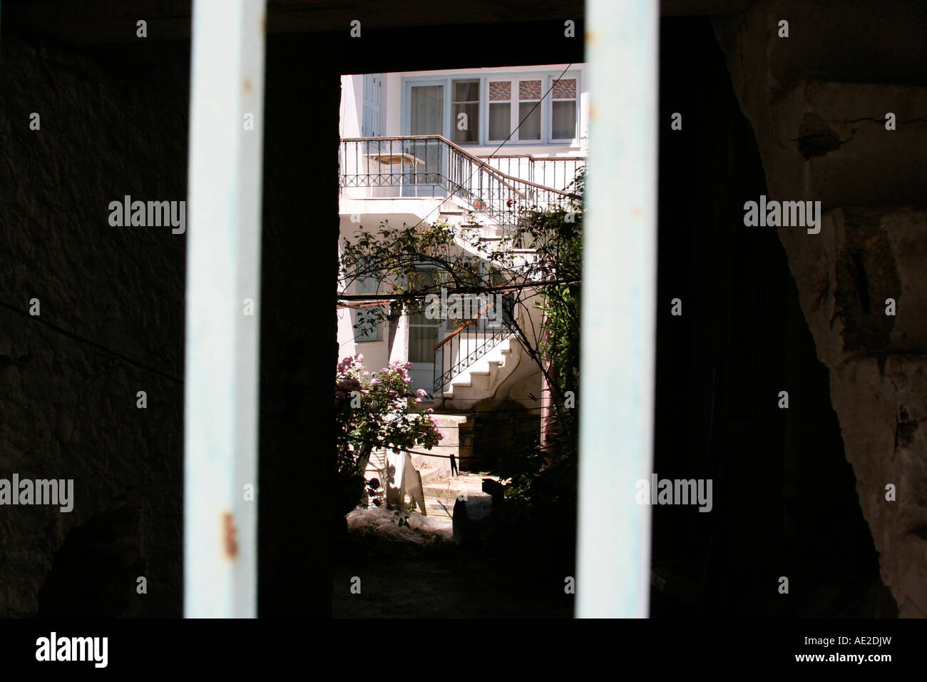 Greek house seen through bars of gate Karia Lefkas Greece Stock Photo ...