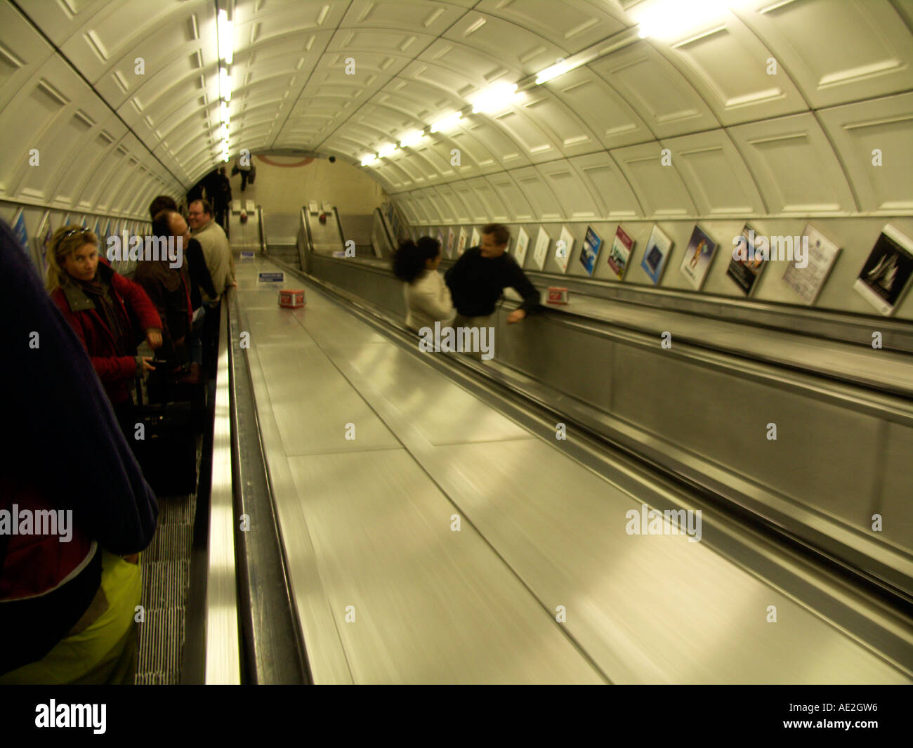 London underground tube train station escalator going down England ...