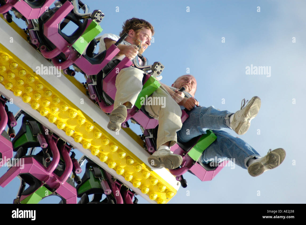 Kids having fun on the fairground rides hi-res stock photography and ...