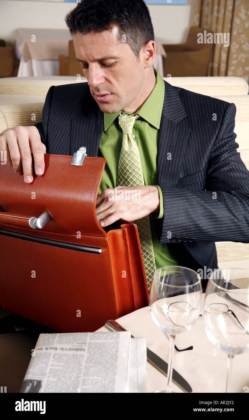 Man sitting at the table in a restaurant Stock Photo - Alamy