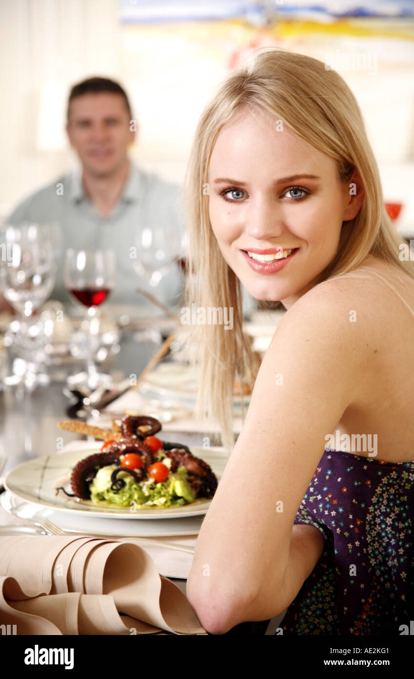 Young woman dining in a restaurant Stock Photo - Alamy