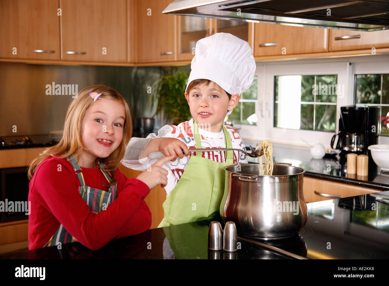 Children cooking spaghetti Stock Photo - Alamy