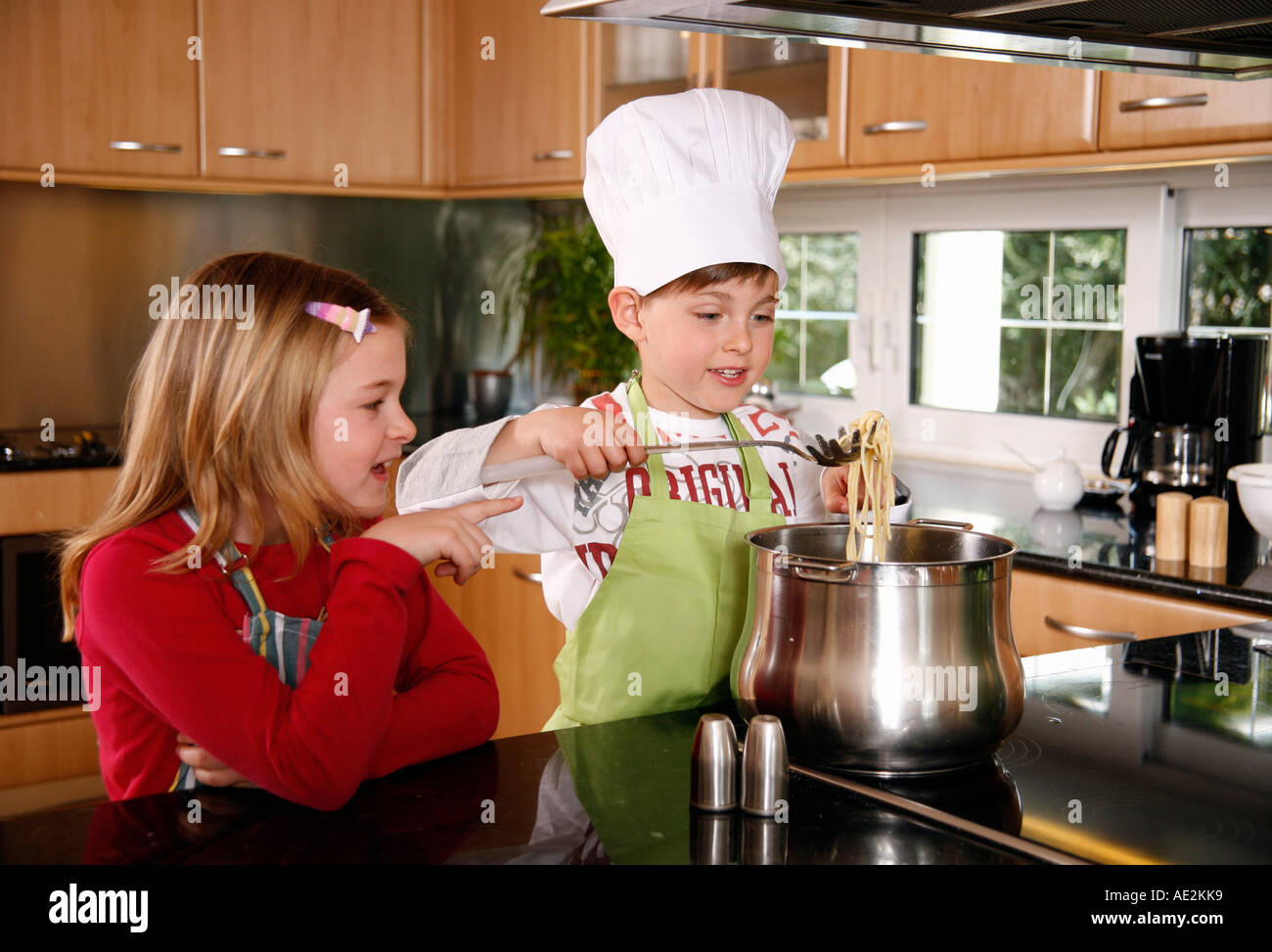 Children cooking spaghetti Stock Photo - Alamy