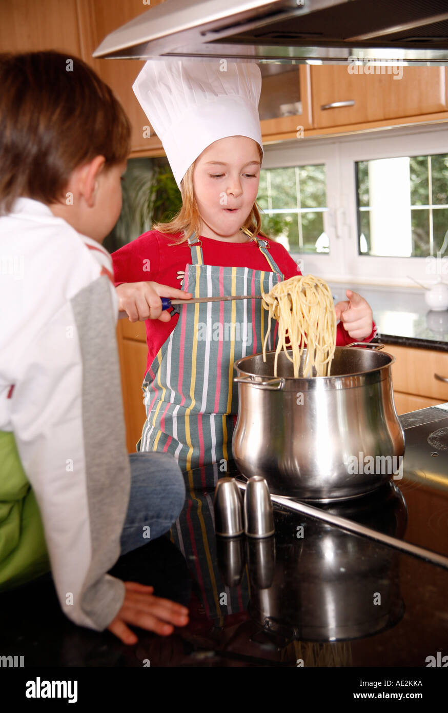 Children cooking spaghetti Stock Photo - Alamy