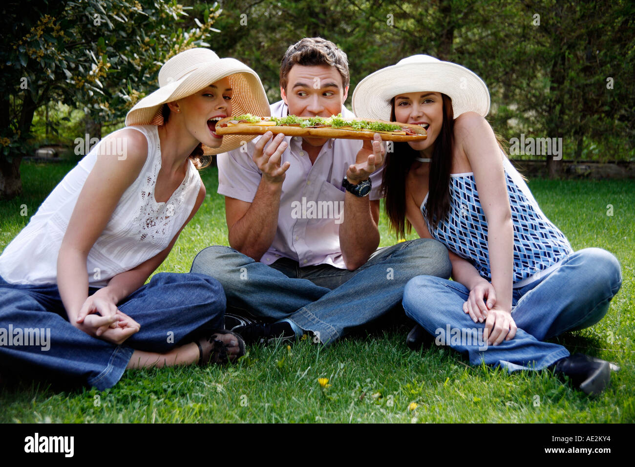 Group young friends eating sandwiches hi-res stock photography and ...