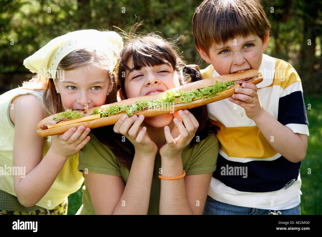 Child sharing sandwich hi-res stock photography and images - Alamy