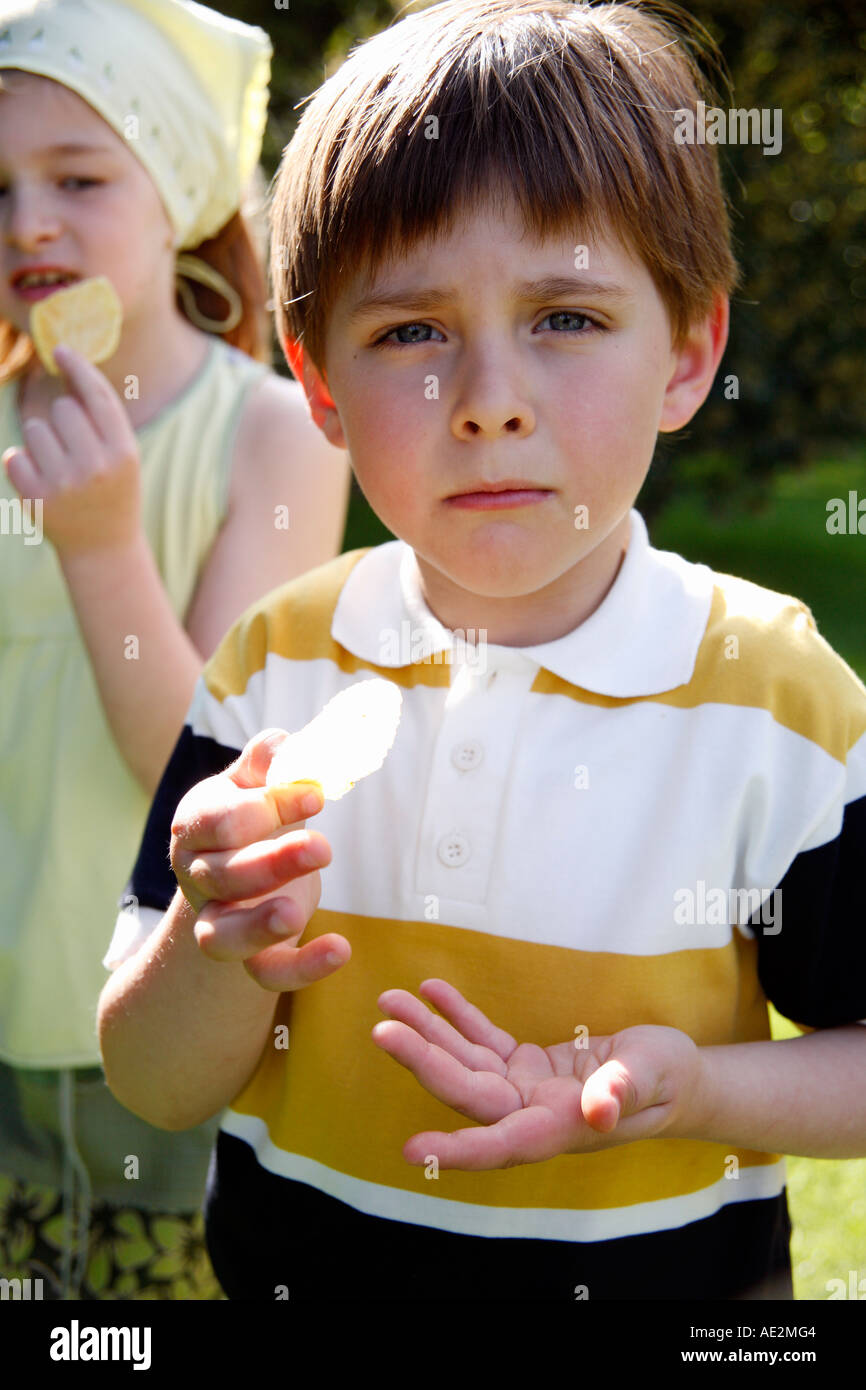 Children eating potato chips Stock Photo - Alamy