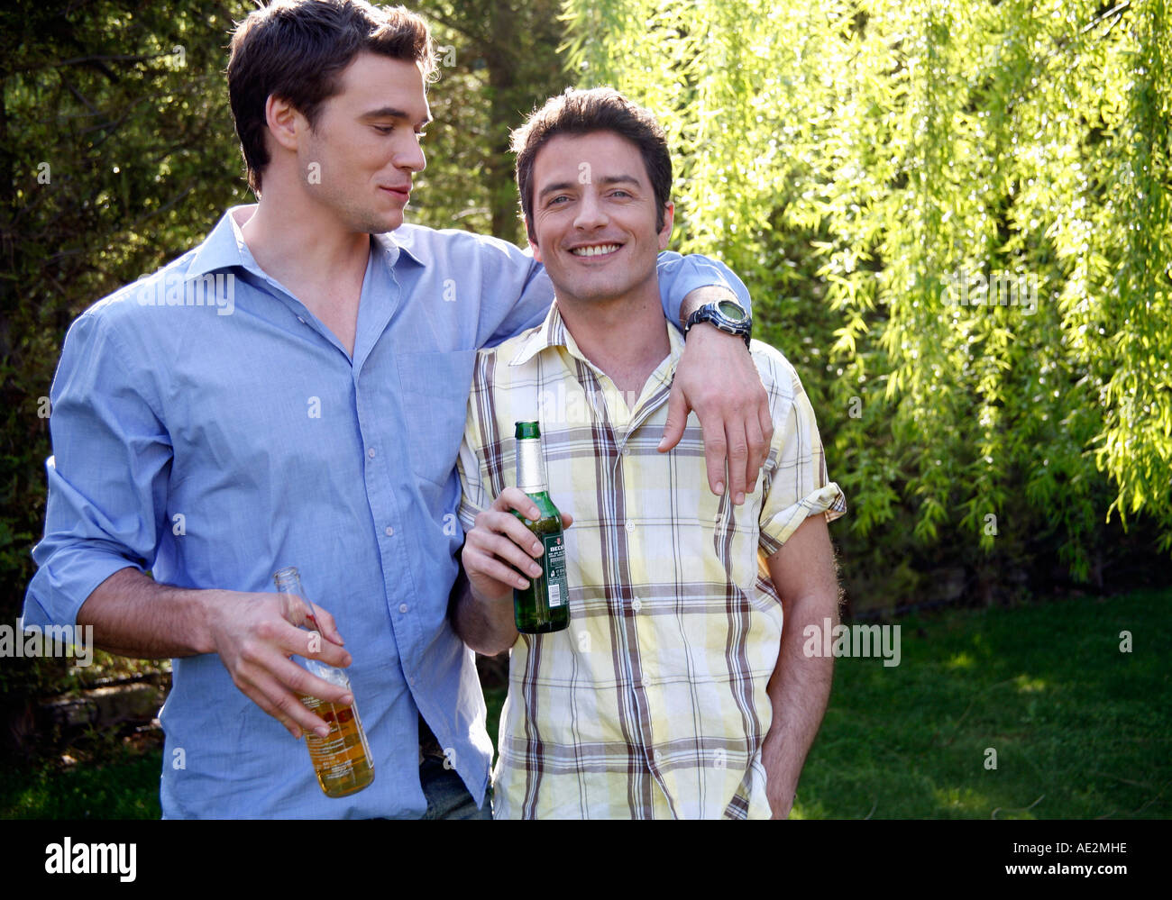 Two men drinking beer Stock Photo - Alamy