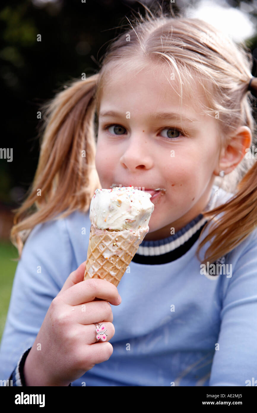 Young girl eating ice cream Stock Photo - Alamy