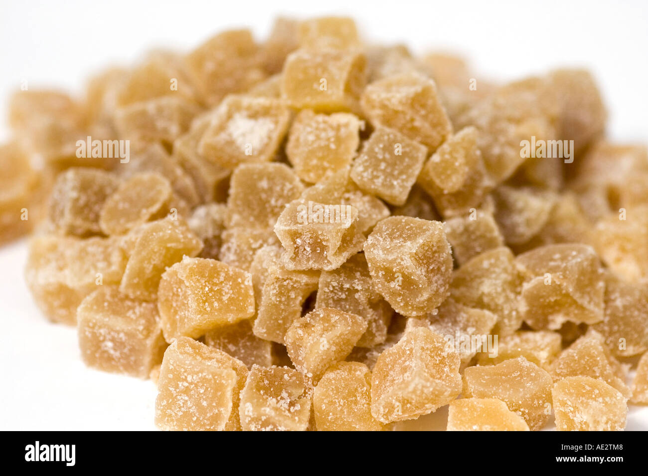 Crystalised Ginger closeup with white background Stock Photo - Alamy