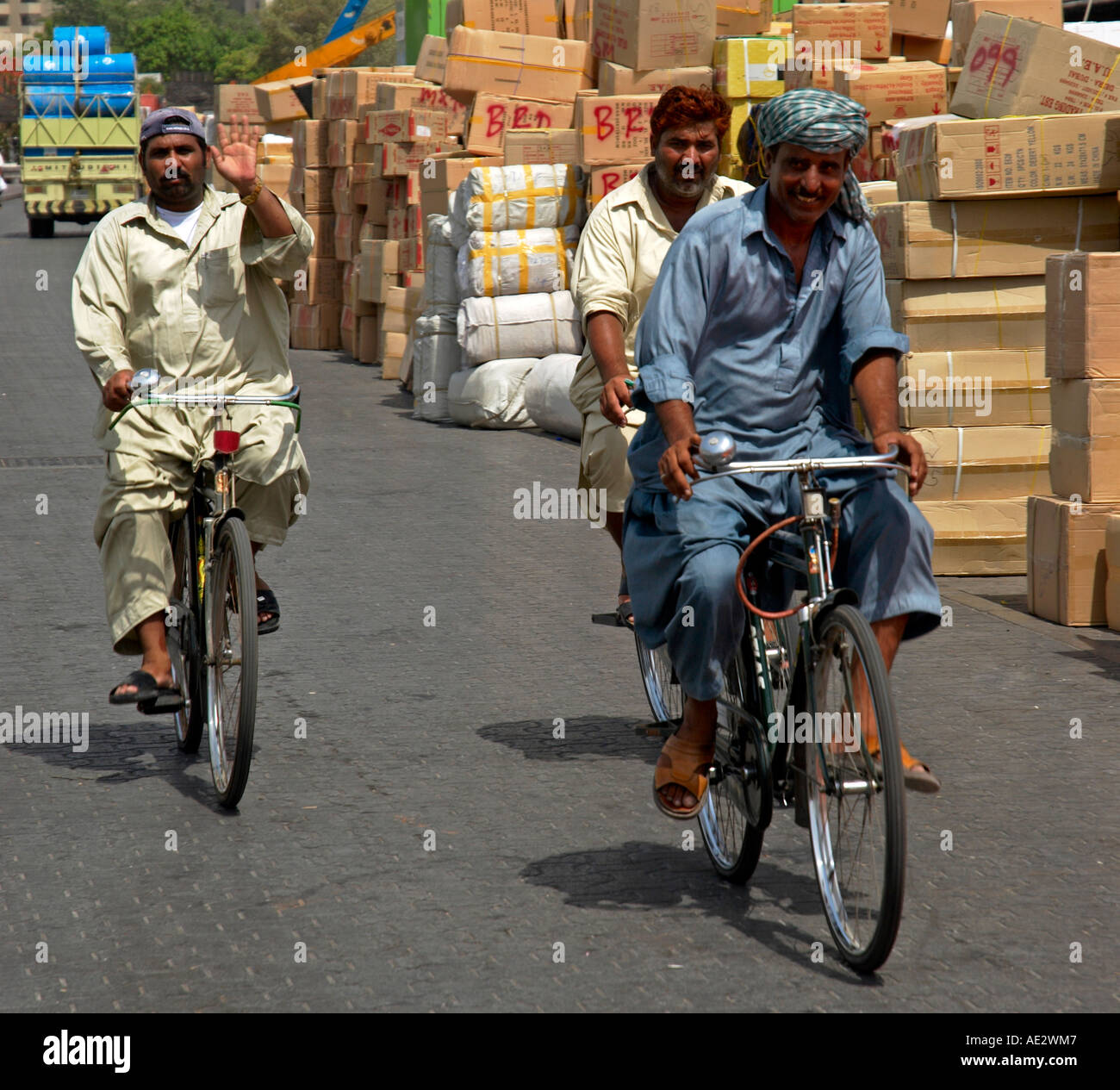 Happy Indian Workers Cycling to Work Dubai UAE Stock Photo - Alamy