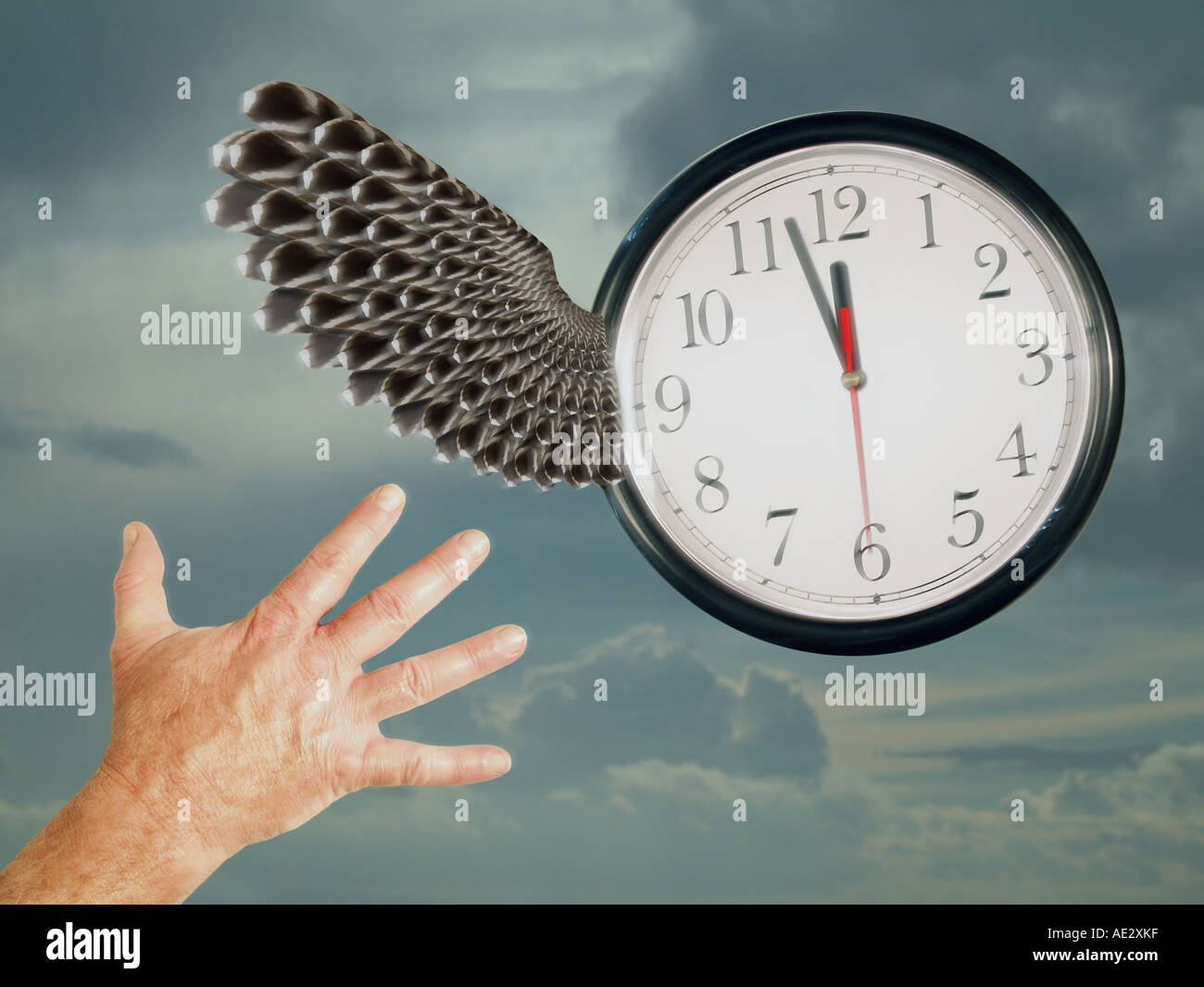 Hand reaching for a flying clock Stock Photo - Alamy
