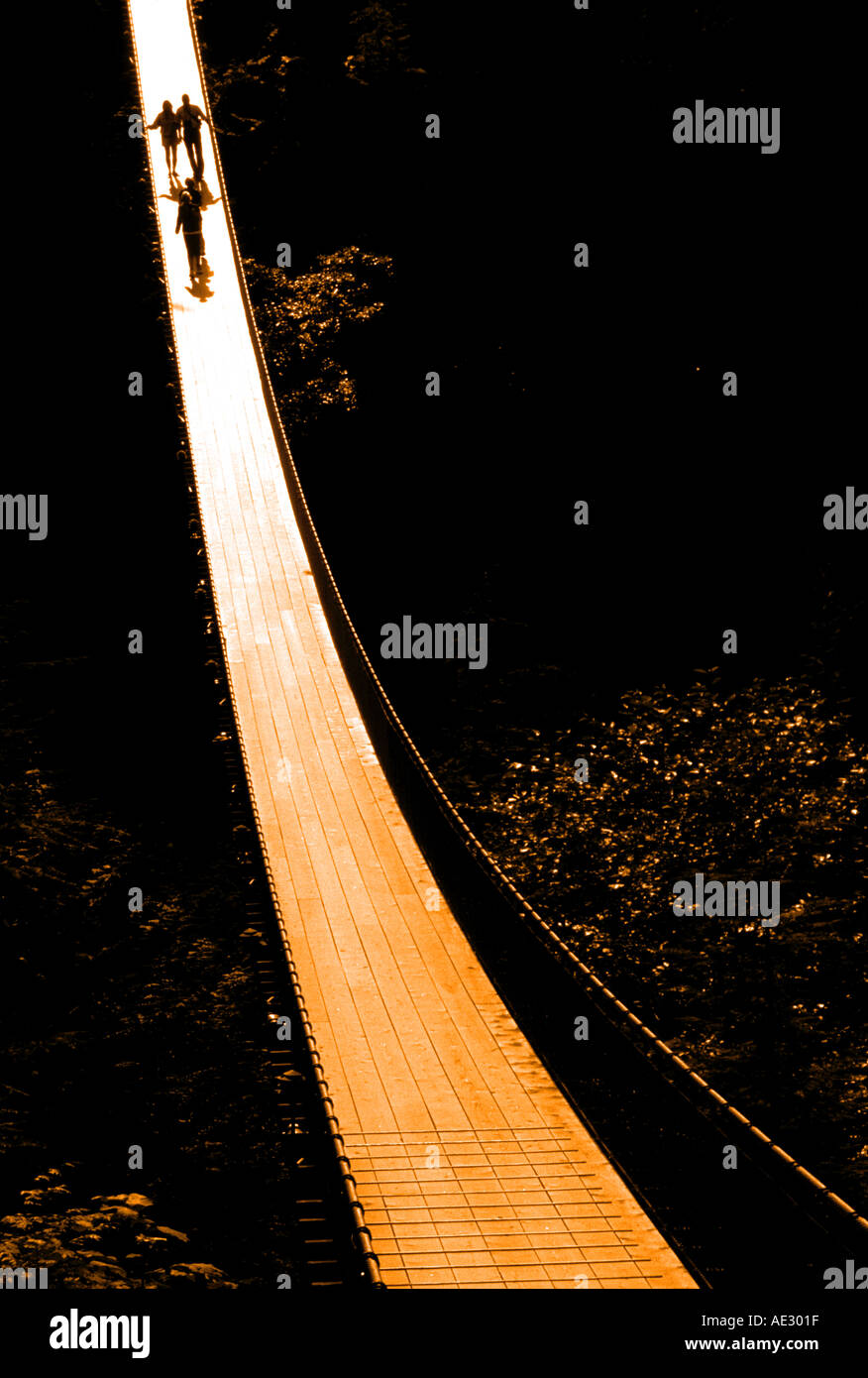 Person on suspension bridge hi-res stock photography and images - Alamy