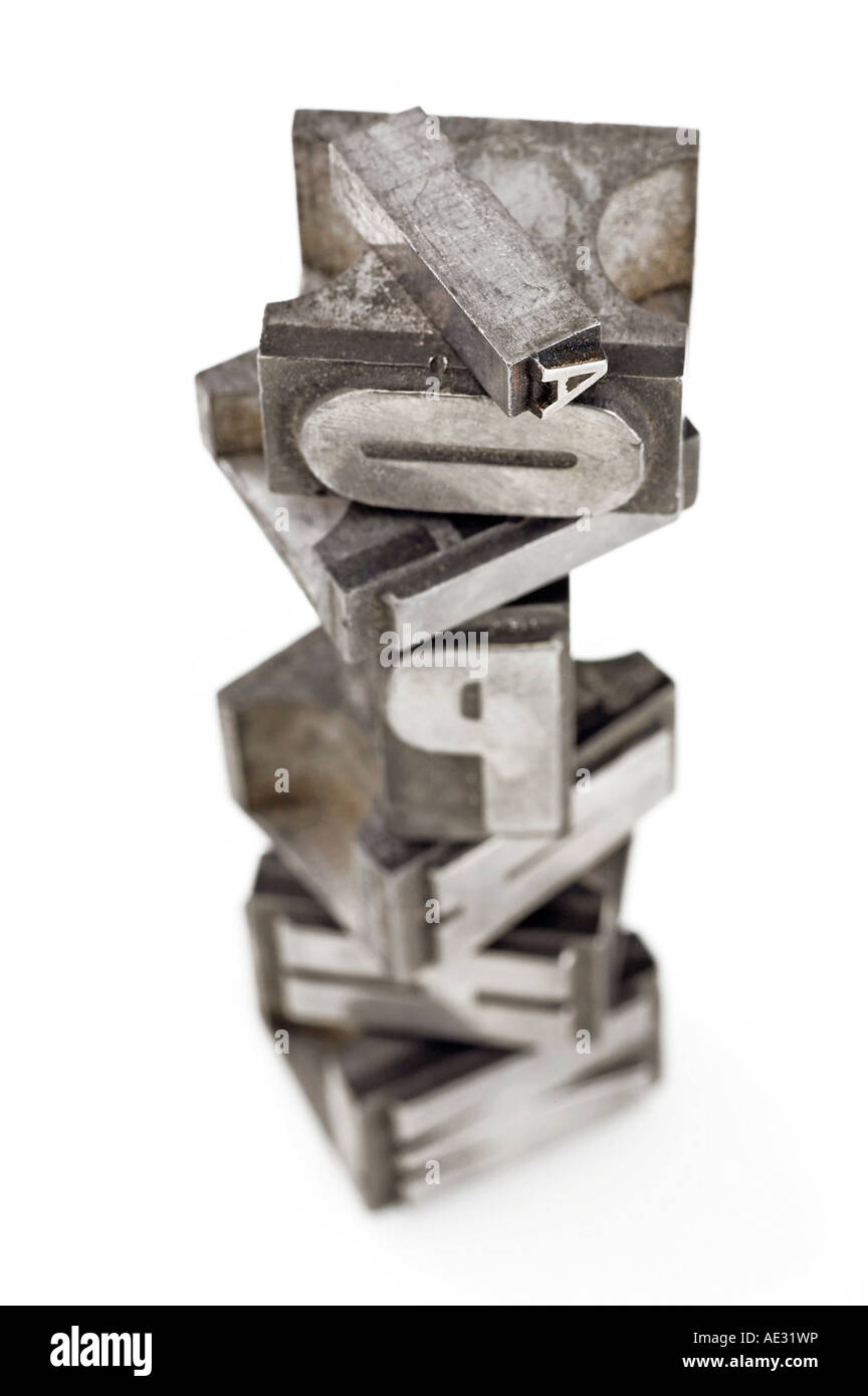 Stack of lead letters on white background Stock Photo - Alamy