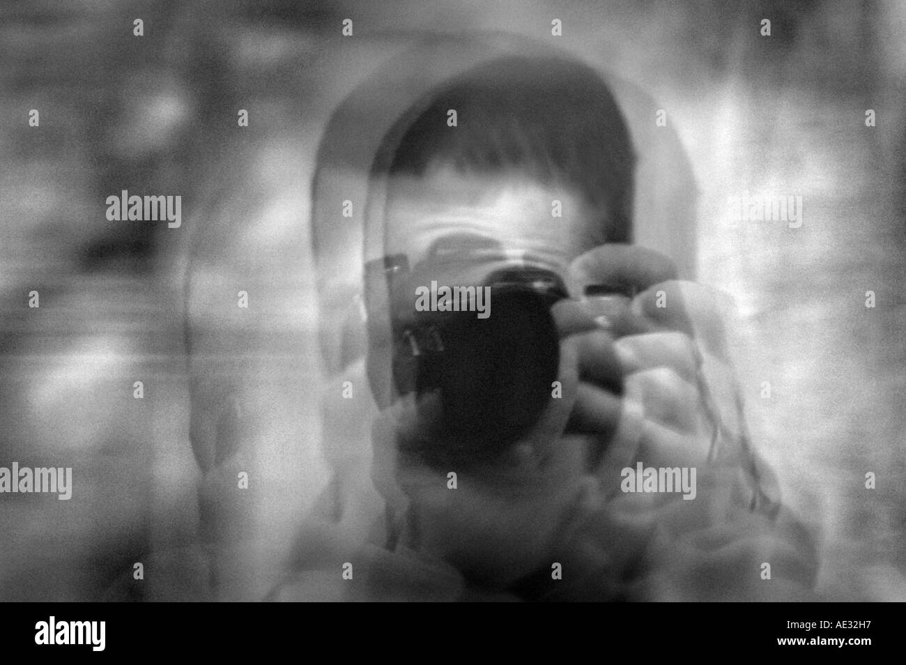 Multiple reflection of self portrait, photographer Stock Photo - Alamy