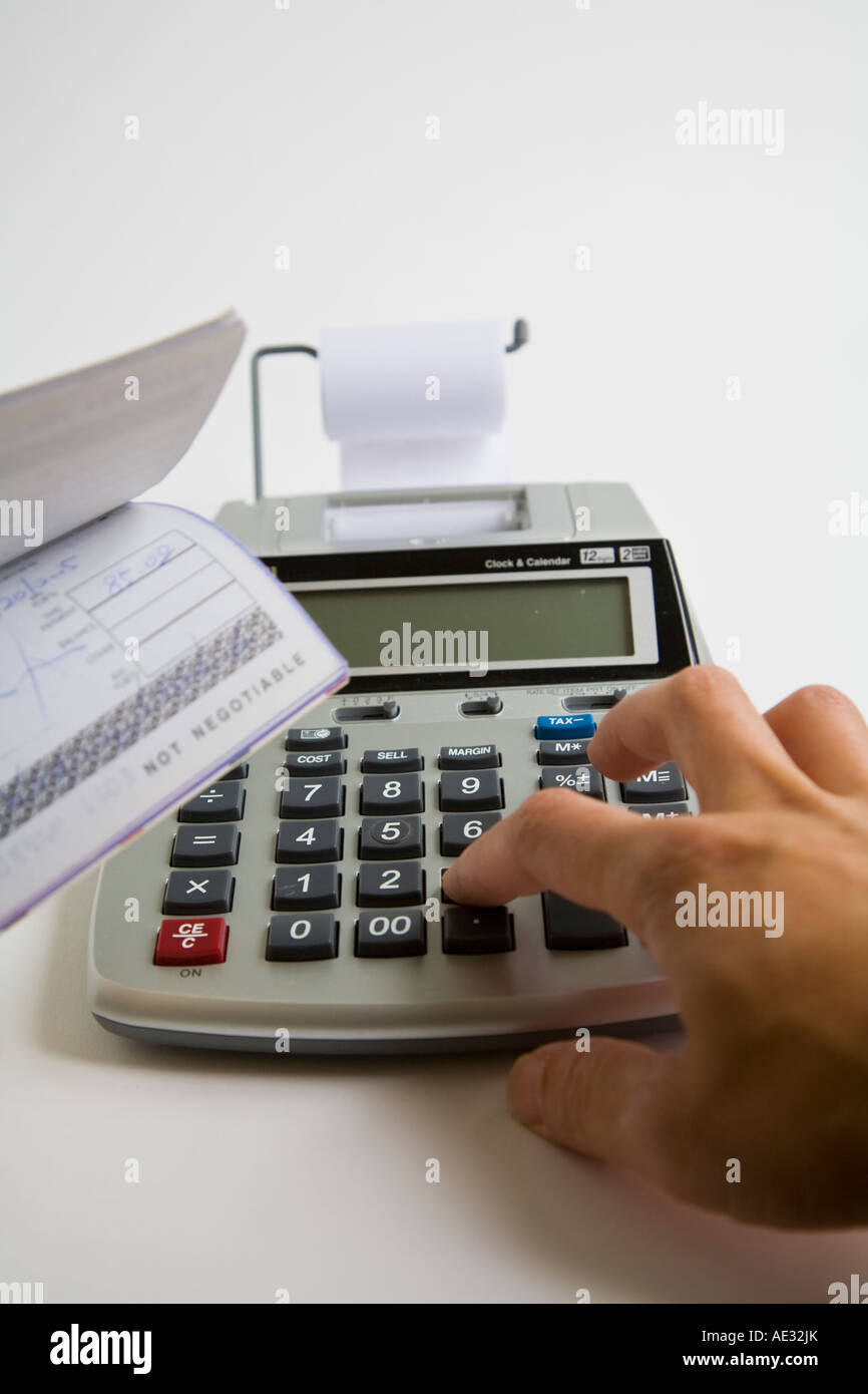 Handheld Calculator and Checkbook Stock Photo - Alamy