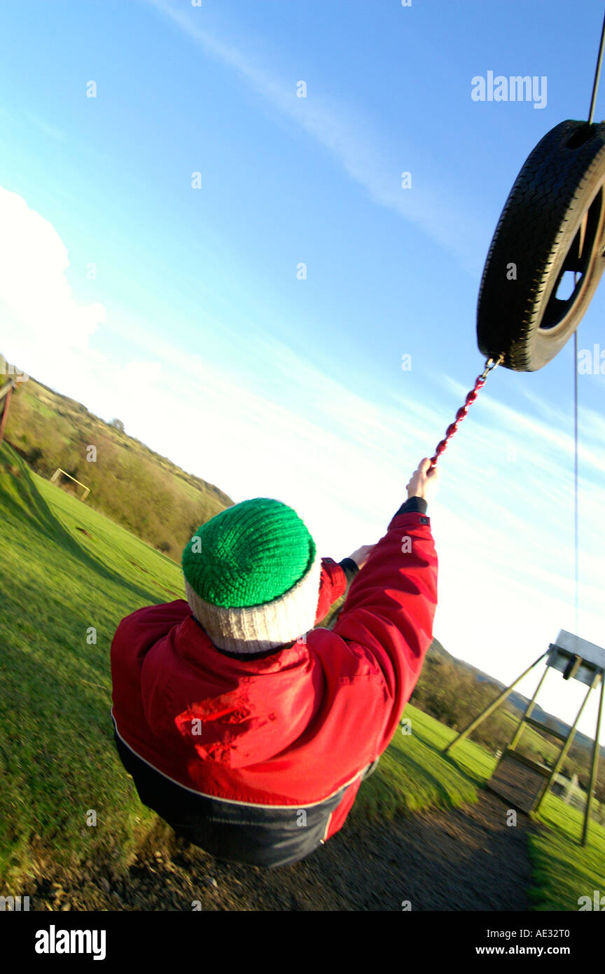 Man in 20s riding ropeway children playground outdoors Stock Photo - Alamy