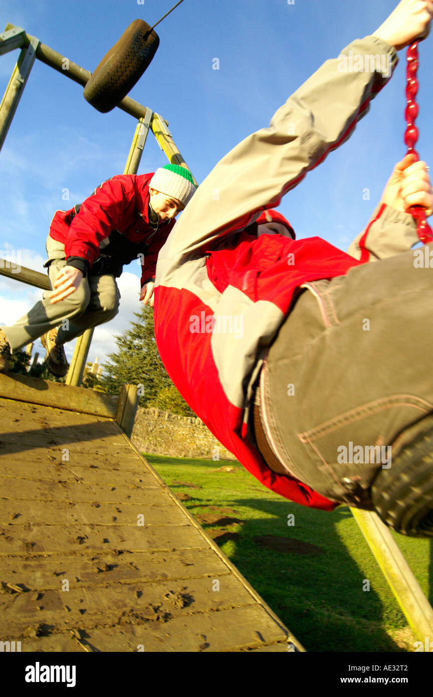 Woman in 20s riding ropeway children playground outdoors Stock Photo ...