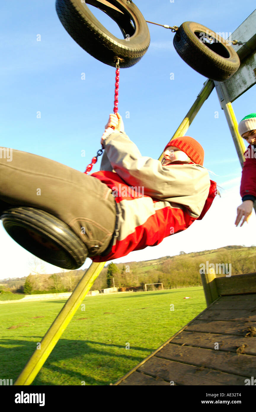 Woman in 20s riding ropeway children playground outdoors Stock Photo ...