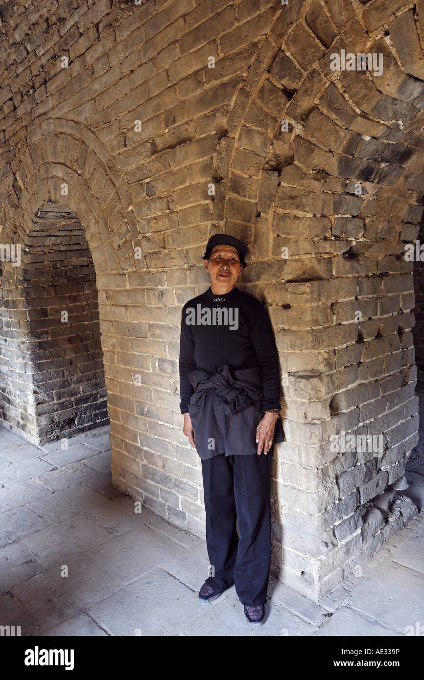 Woman standing in chamber inside a Great Wall watch tower Simatai Great ...