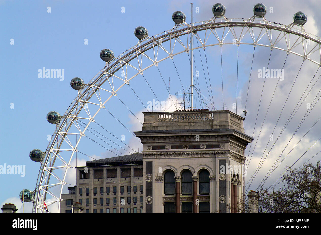 Detail of London Eye behind Central London building, seen from St ...