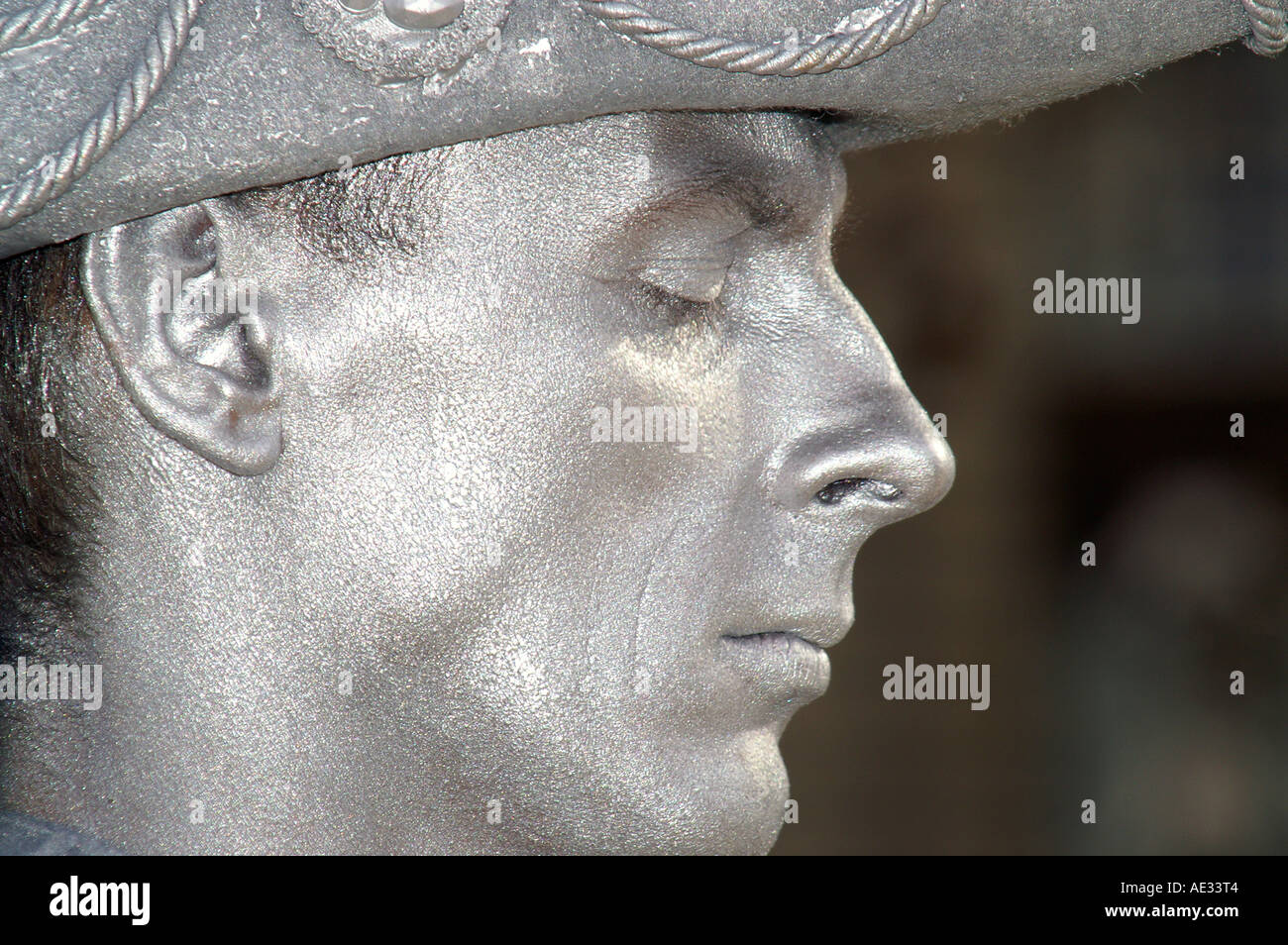 Live statue, silver man face Stock Photo - Alamy