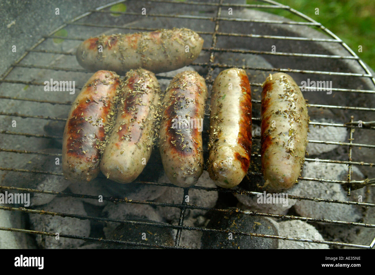 Many mediocre sausages, poor barbecue Stock Photo - Alamy