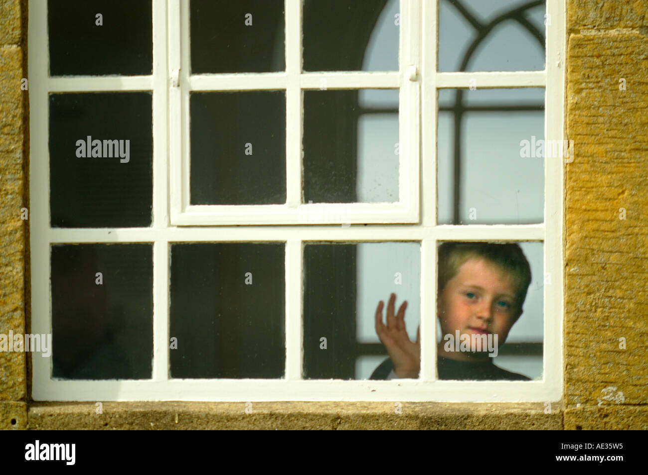 Kid boy looking through the window at Broadway Tower Stock Photo - Alamy