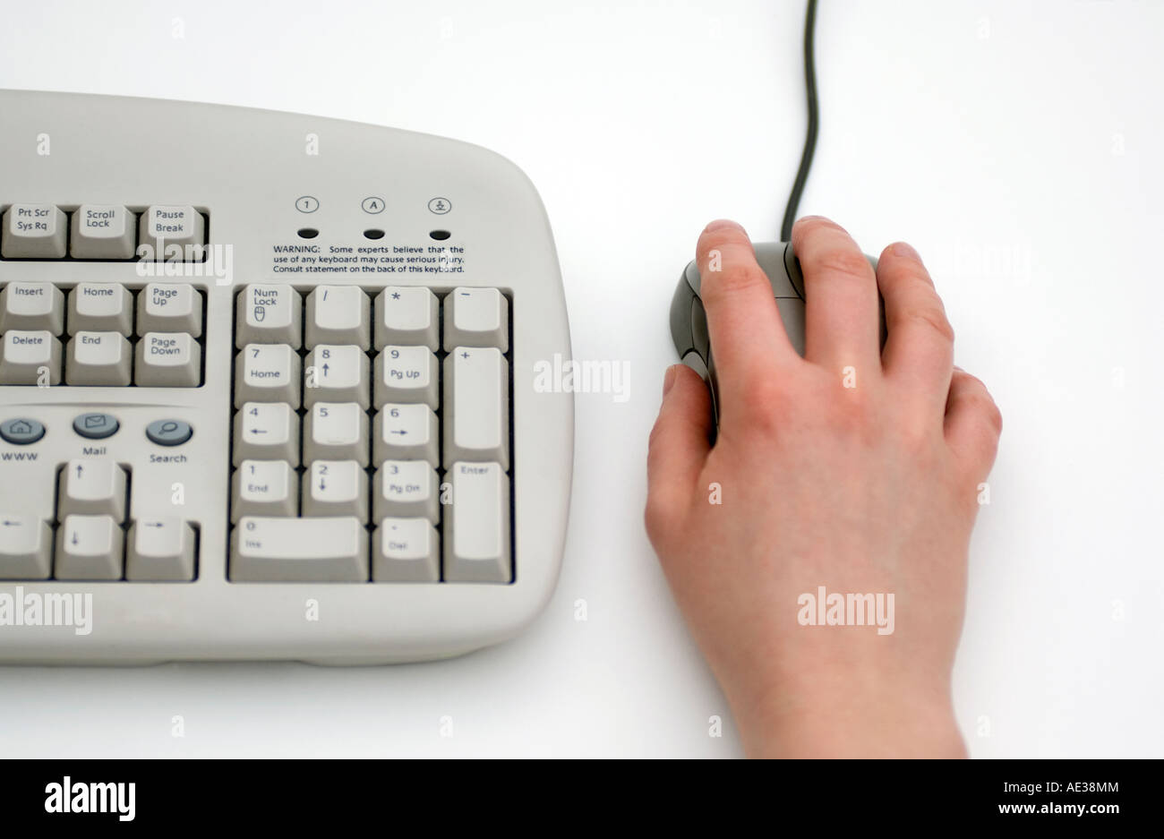 Doug Blane Computer mouse and keyboard with a hand on the mouse concept ...