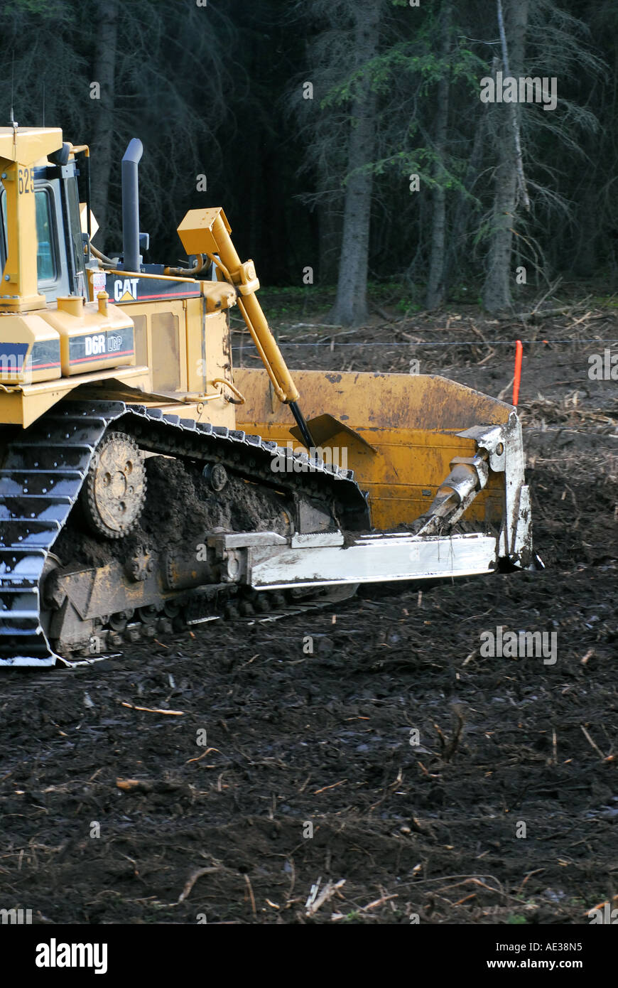 Bull Dozer blade pushing dirt Stock Photo - Alamy
