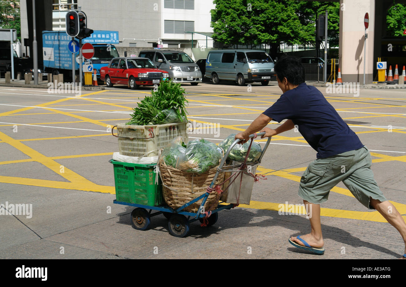 Chinese man vegetable cart hi-res stock photography and images - Alamy
