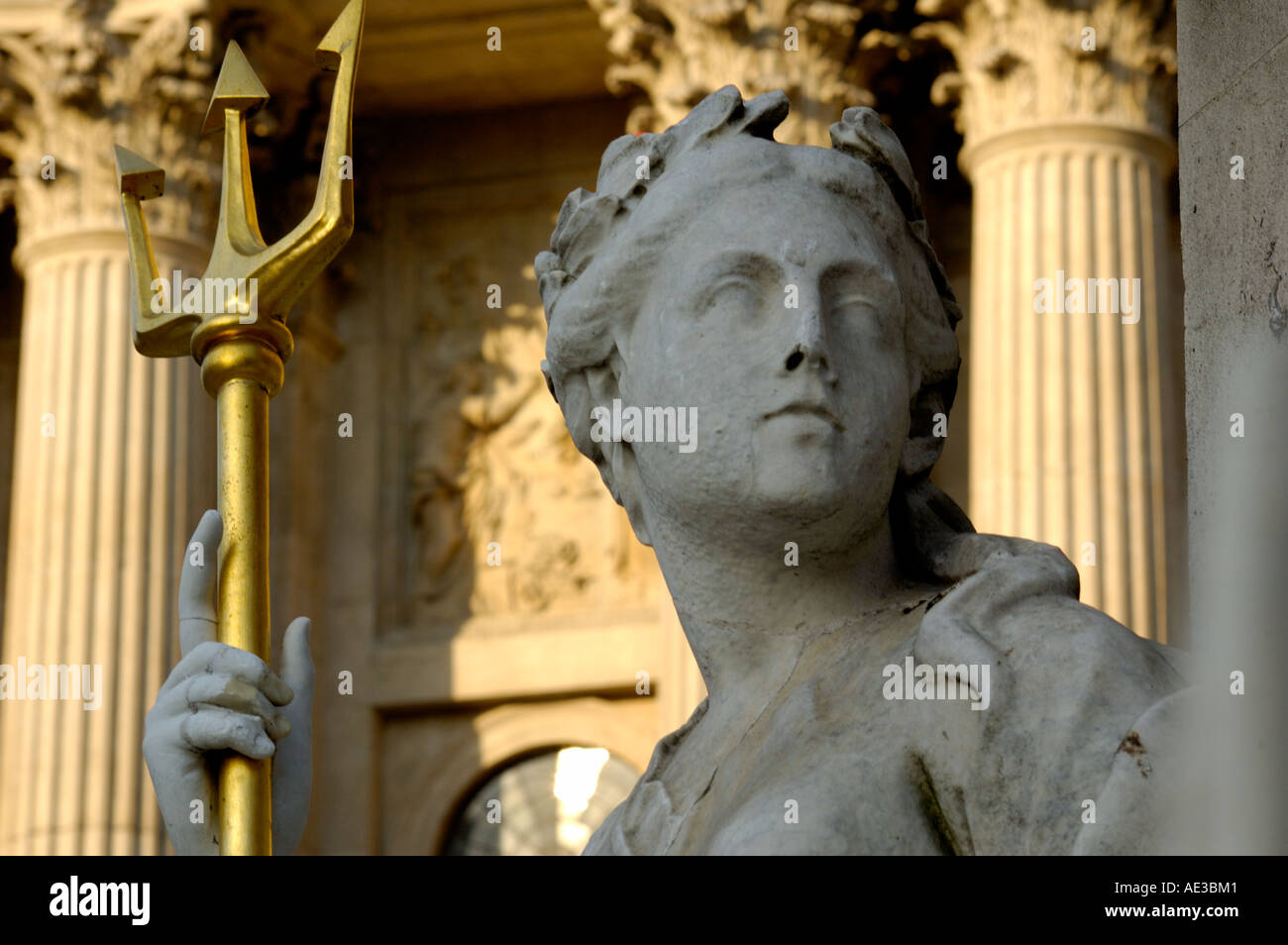 Statue of woman holding trident Stock Photo - Alamy