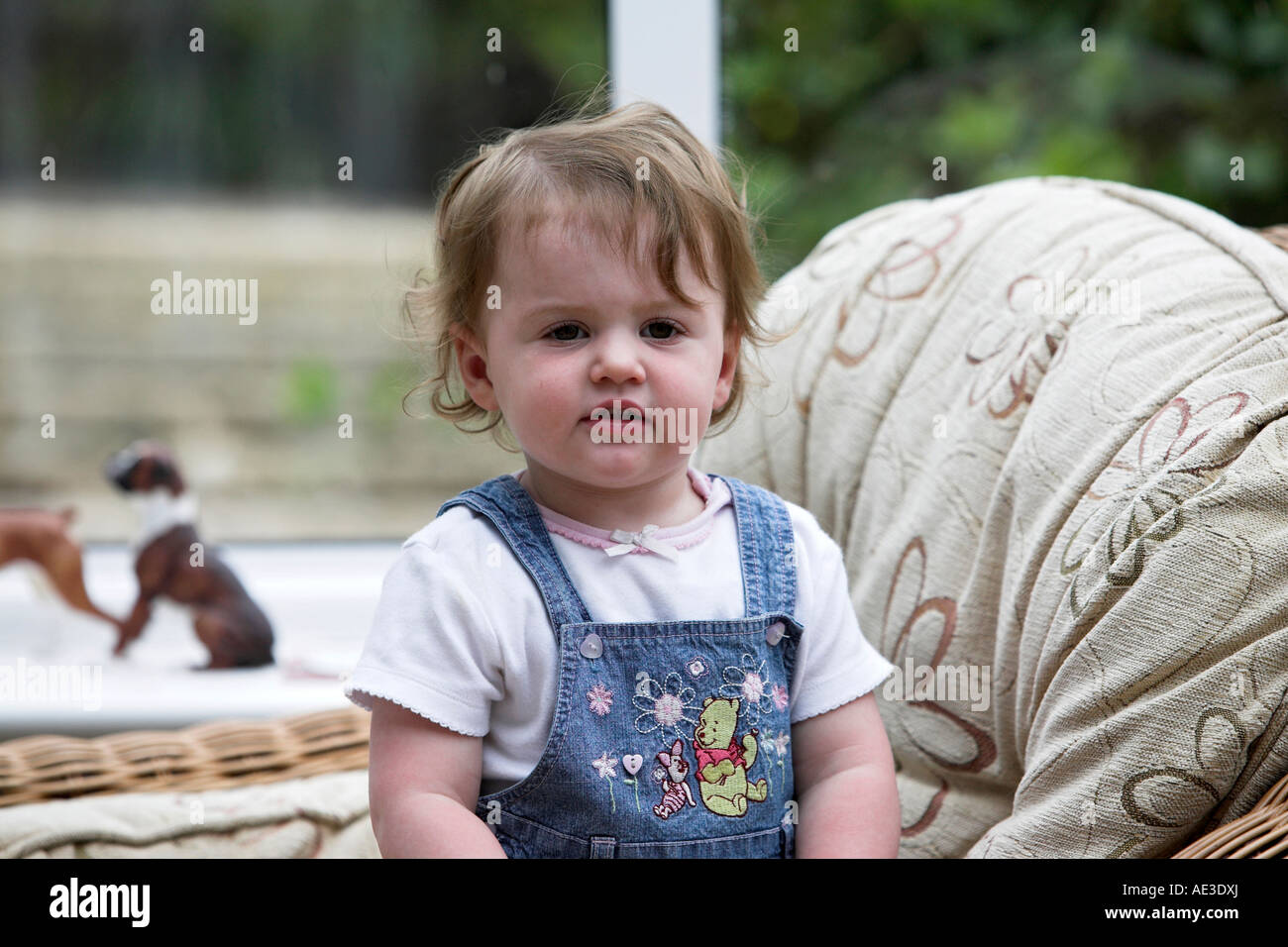 Baby Girl in chair Stock Photo - Alamy