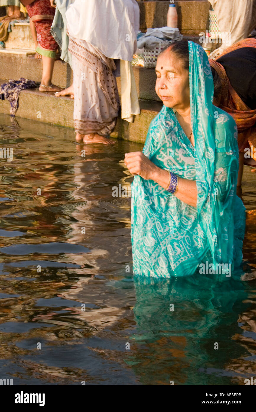 Woman bathing in Varanasi India Stock Photo - Alamy