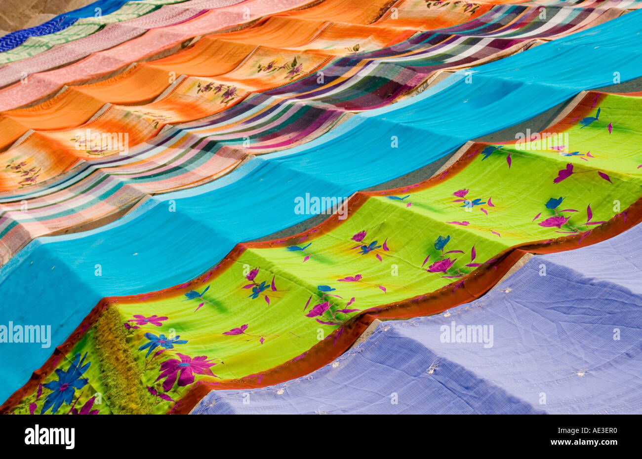 Colourful saris drying under the sun in Varanasi India Stock Photo - Alamy