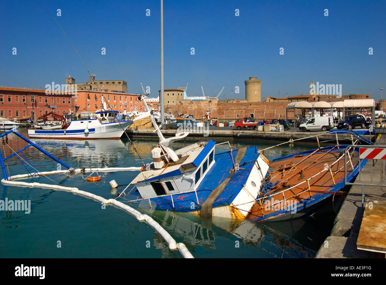 Livorno, Tuscany, Italy. Fishing Boat half sunk in harbour by the ...