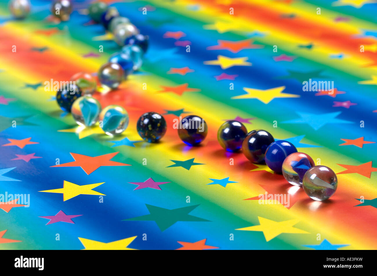 pattern of glass marbles on colourful stars background Stock Photo - Alamy