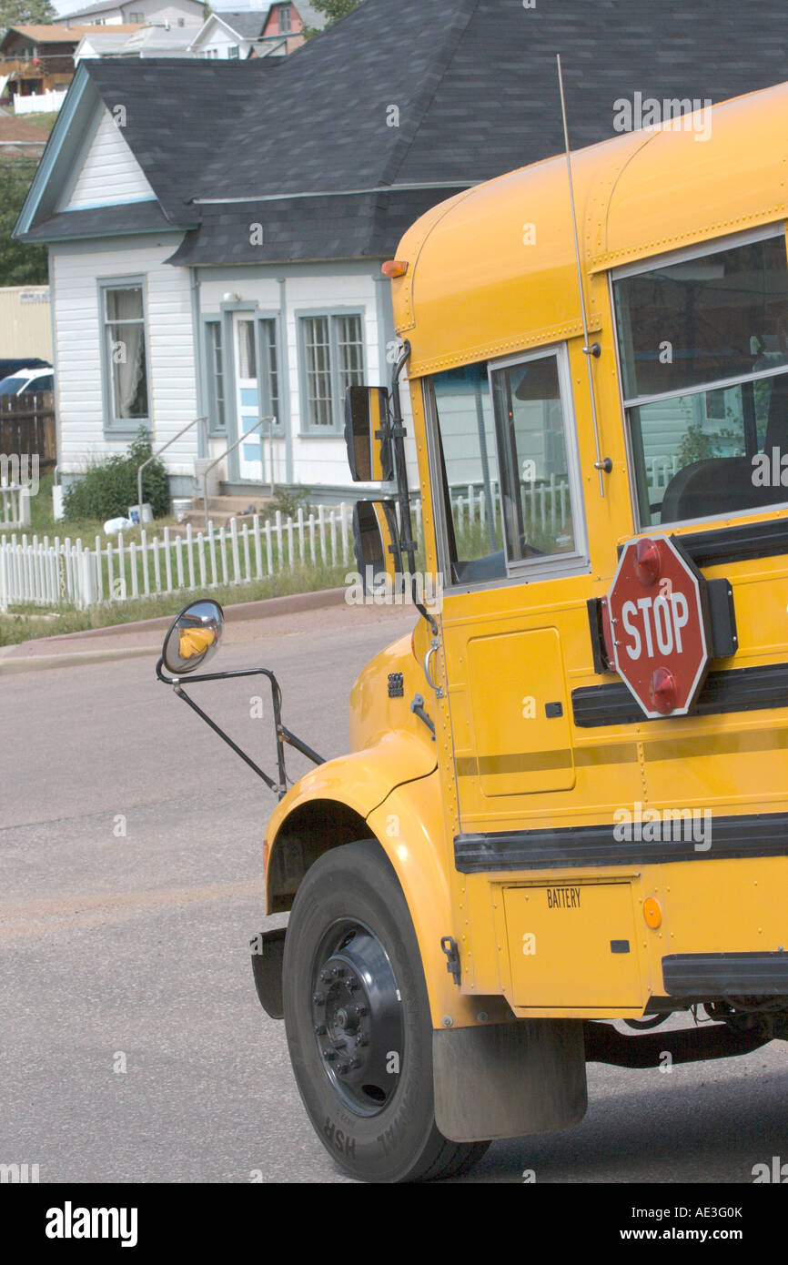 School bus and house Stock Photo - Alamy