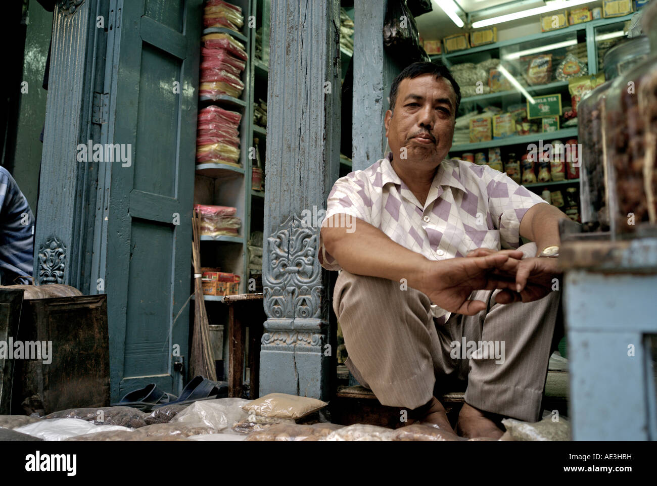 Shopkeeper in Kathmandu Stock Photo - Alamy