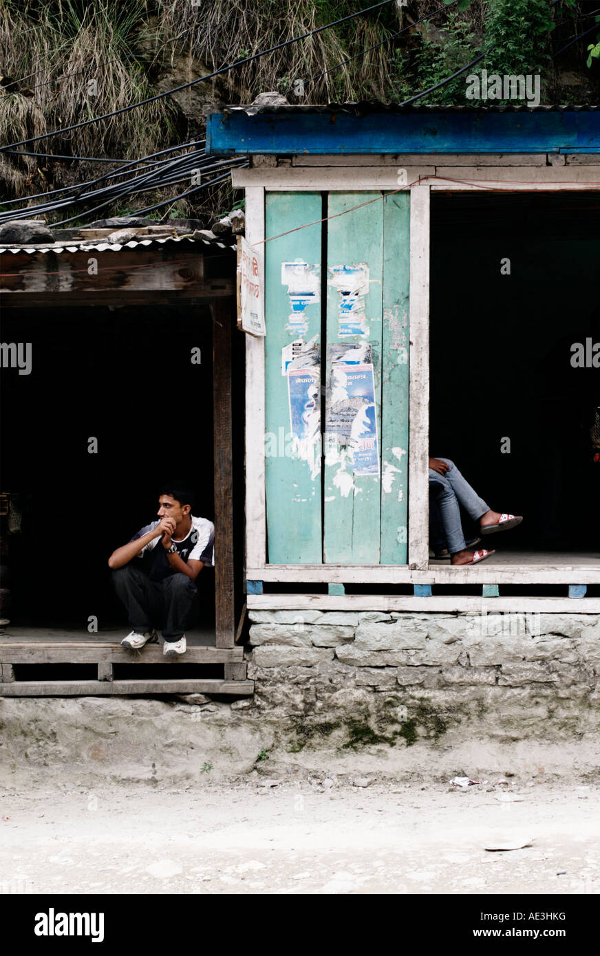 People lazing around on border town Stock Photo - Alamy